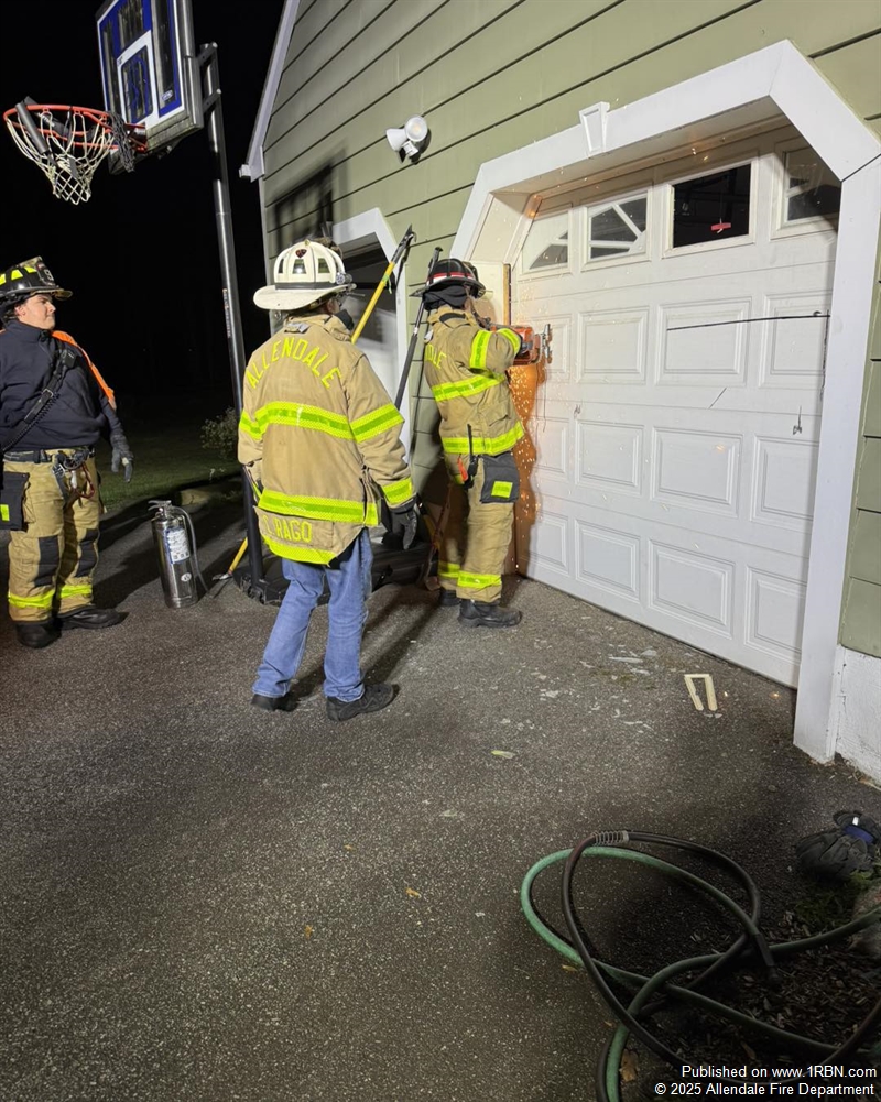 Firefighters Sharpen Garage Entry Skills During Training Drill